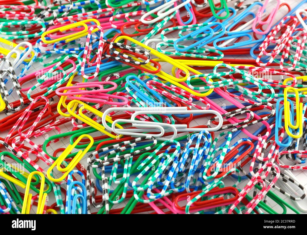 Color clips on checked paper Stock Photo - Alamy