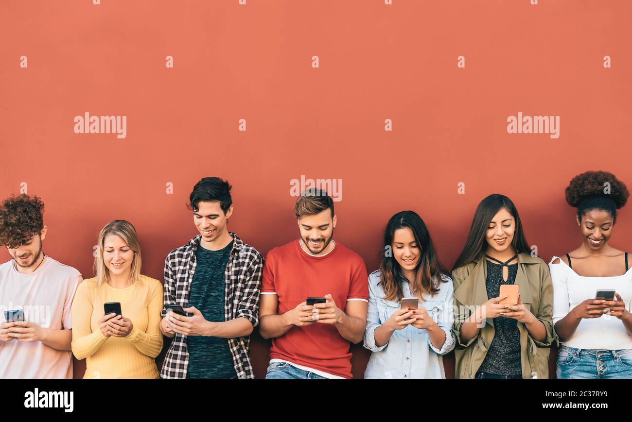 Group young people using mobile smartphone outdoor - Millennial generation having fun with new ...