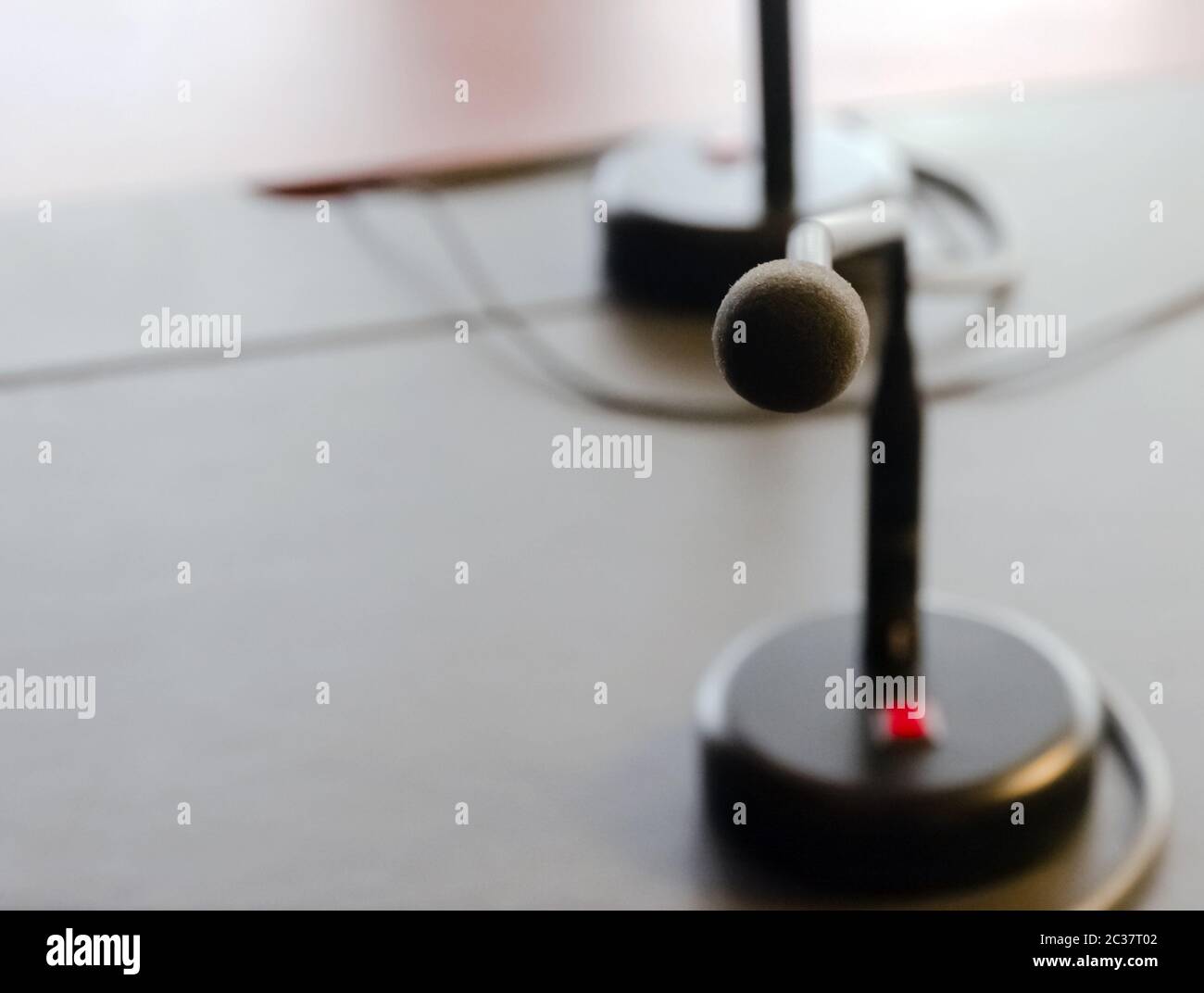 a table microphone on the wooden table of a board Stock Photo - Alamy