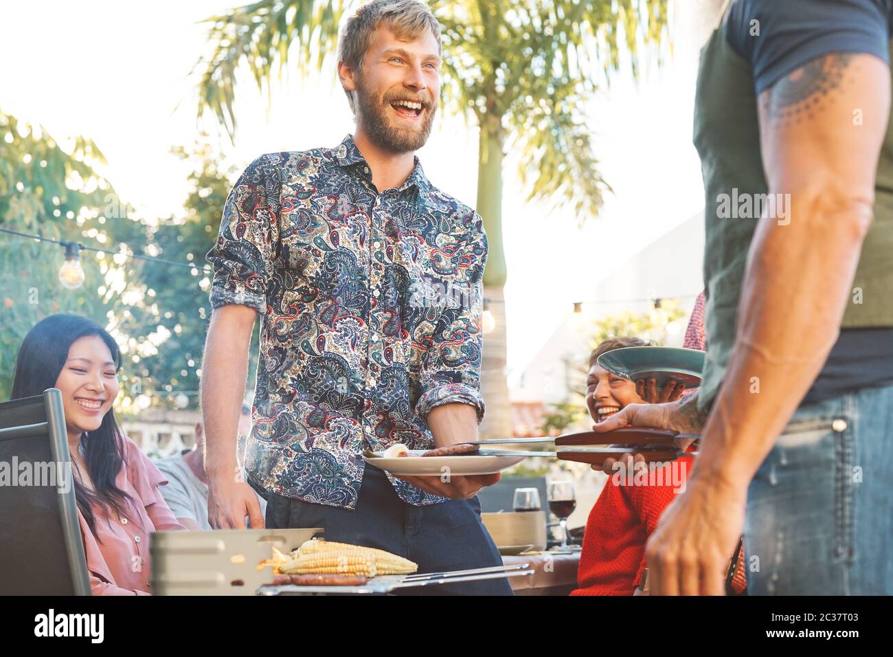 Happy family having fun at barbecue party - Chef senior man grilling ...