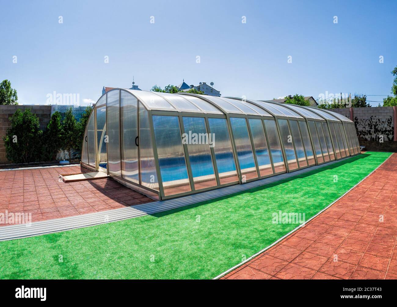 Covered summer pool with a blue tile. The covered area of the outdoor ...