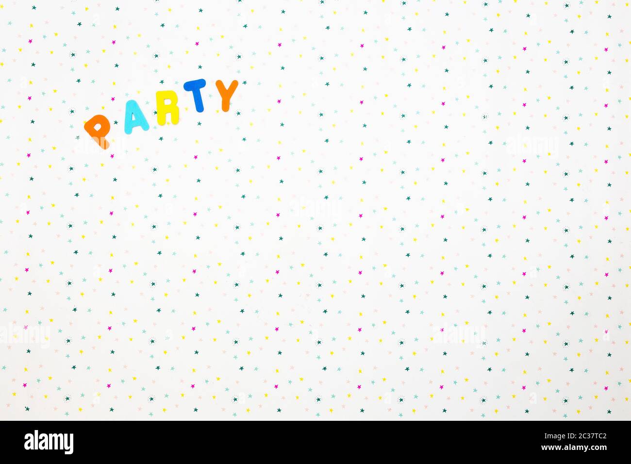 The word party printed on a various colored stars background, colorful ...