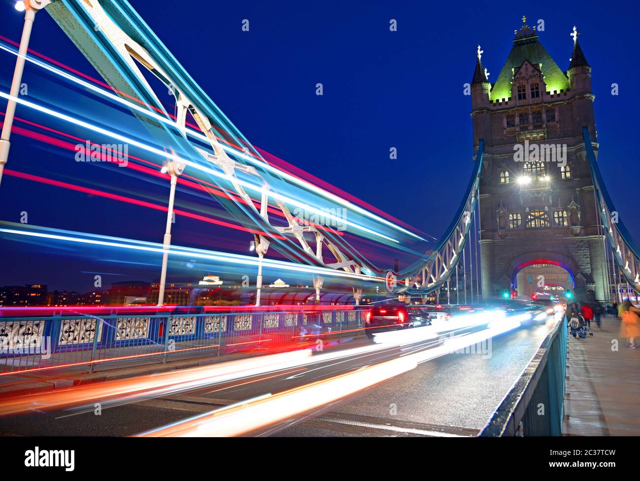 Vehicles pass over Tower Bridge across the River Thames in London, UK ...