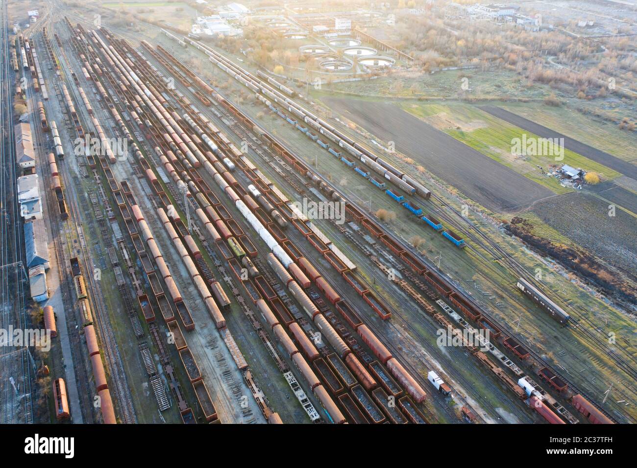Aerial view of various railway carriage trains with goods on the ...