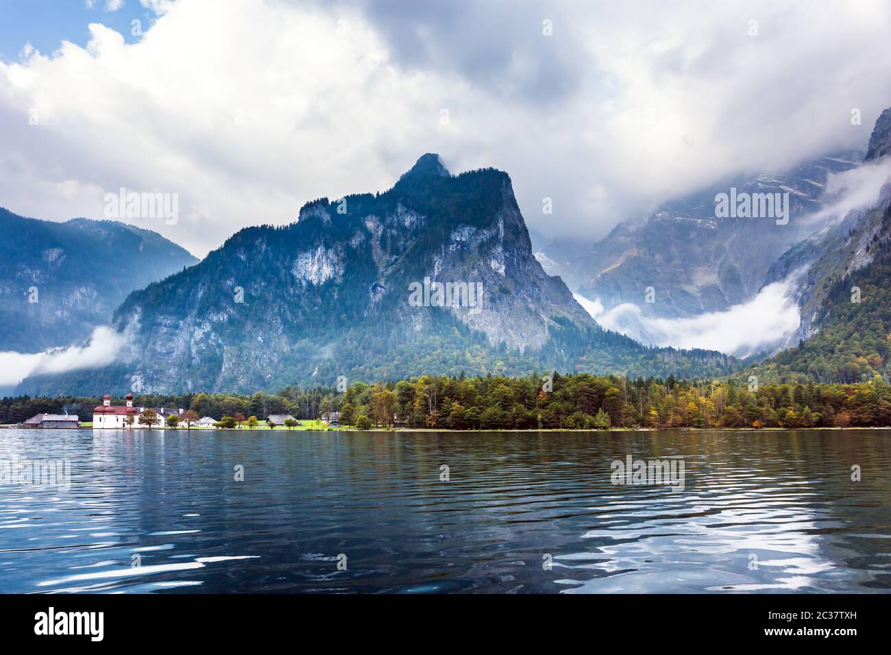 The lake is surrounded by mountains Stock Photo - Alamy