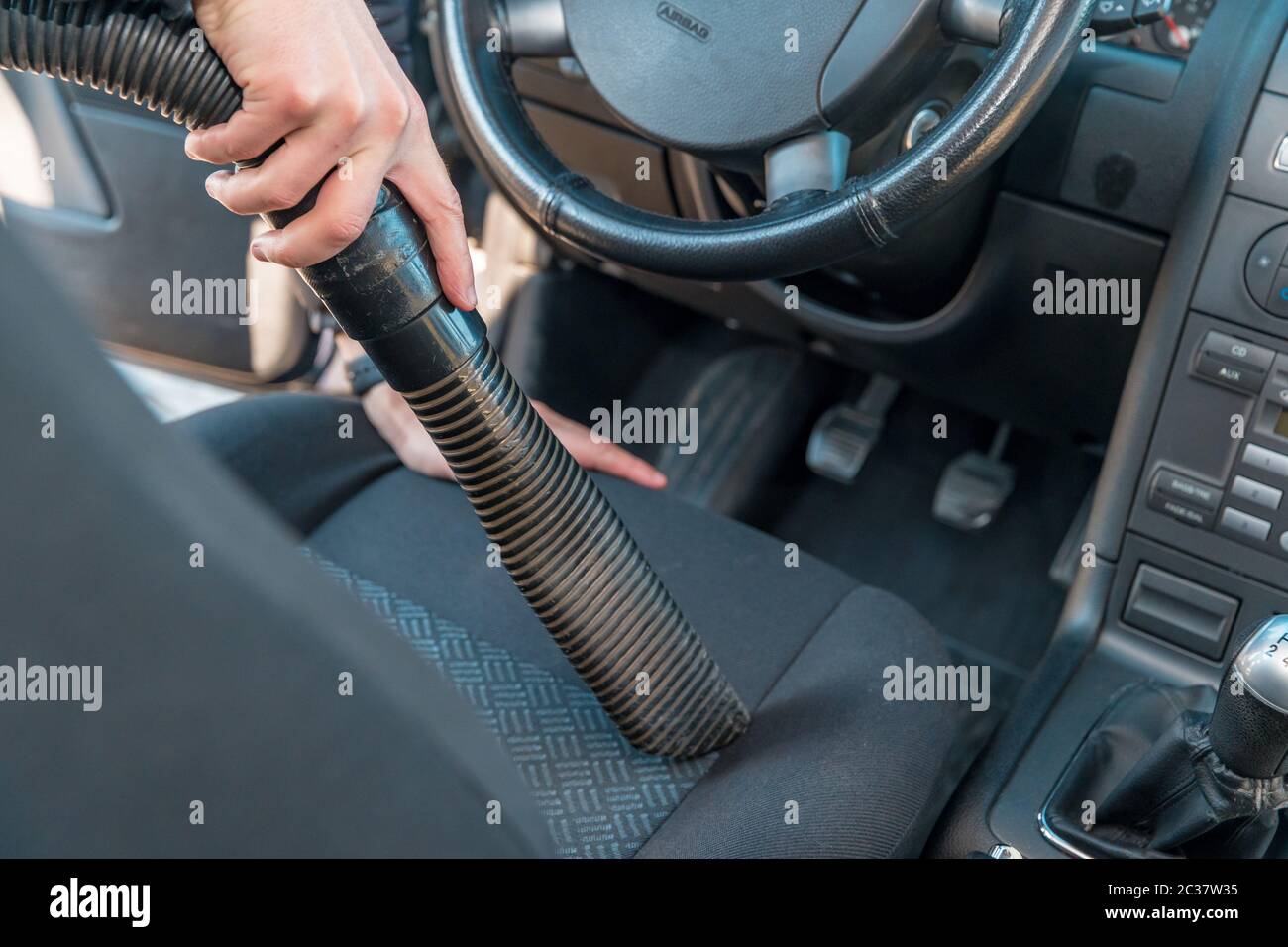 vehicle interior vacuum cleaning. Detail shot of an industrial vacuum ...