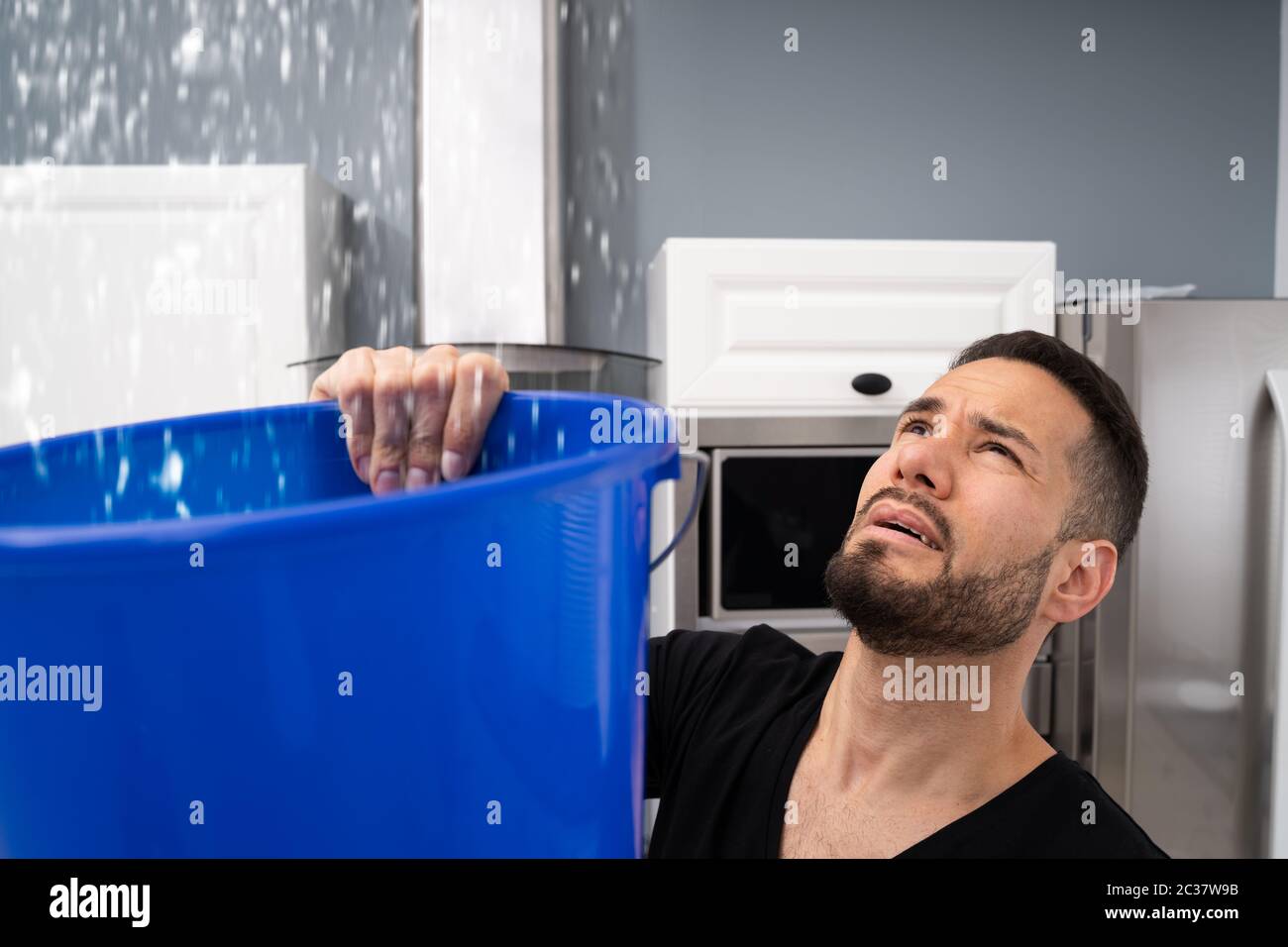 Man water bucket hi-res stock photography and images - Alamy