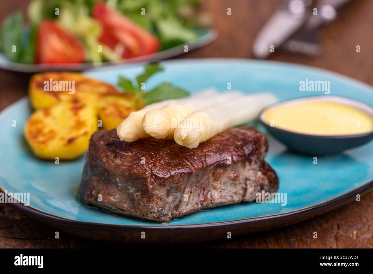 asparagus with potatoes and a steak Stock Photo - Alamy