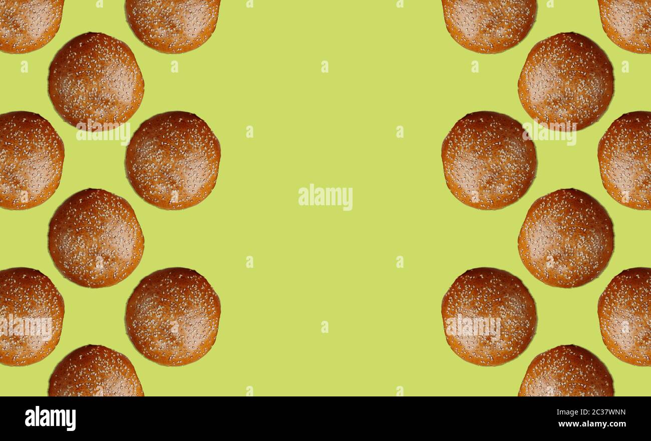 pattern with framed burger buns on a yellow background. Copy space ...