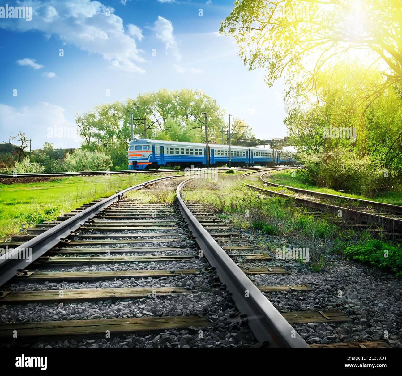 Rotate the railway with train under sunny skies Stock Photo - Alamy