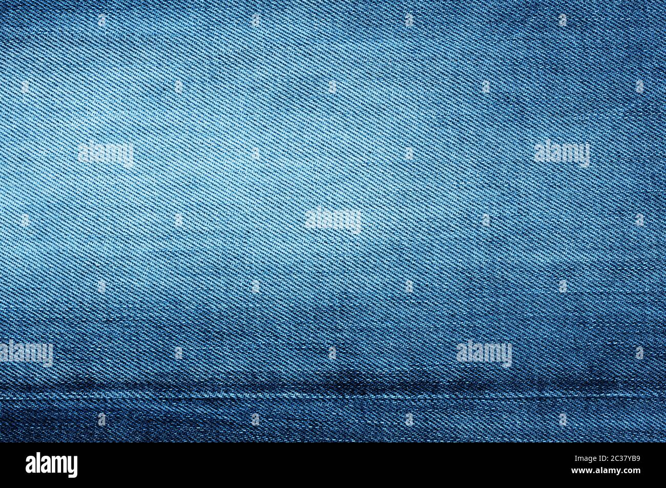 Rough denim blue background with a seam Stock Photo - Alamy