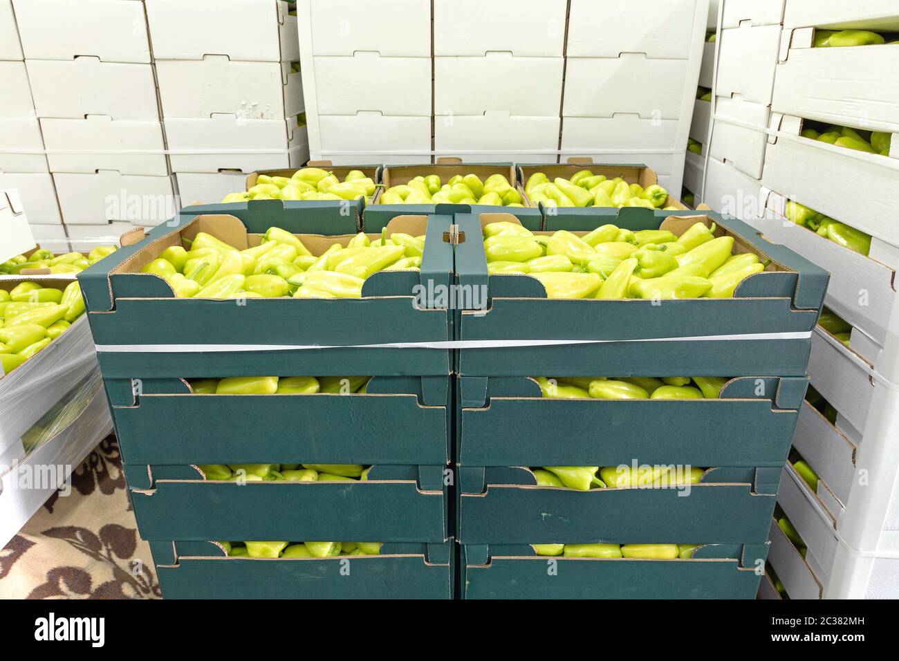 Green Peppers in Boxes Storage Warehouse Stock Photo - Alamy