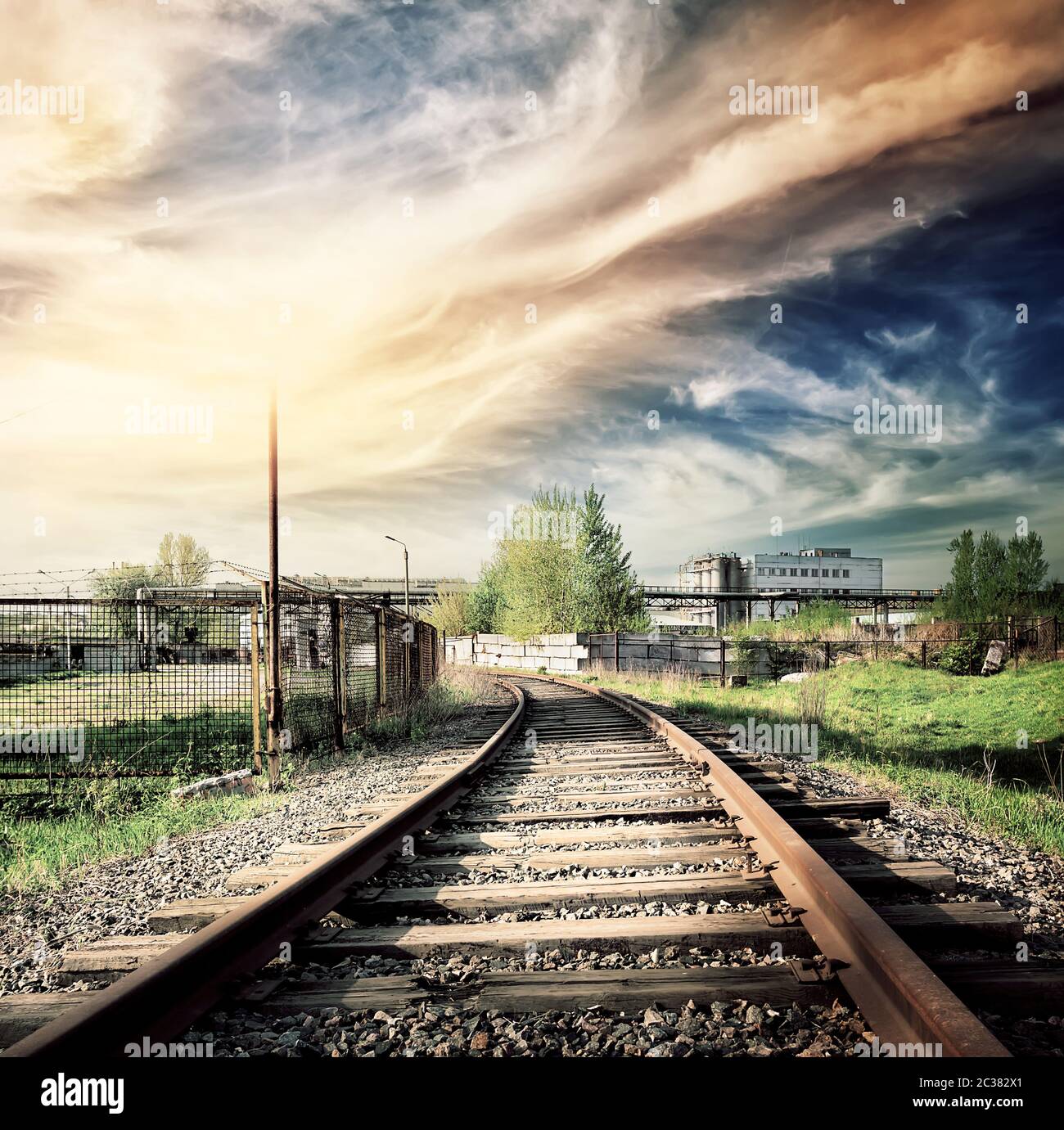 Old rusty railroad leading to the industrial zone Stock Photo - Alamy