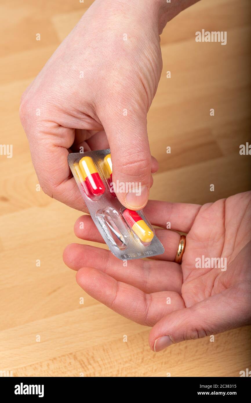 Medicine : capsules in the hand of a woman, woman taking medicine Stock ...