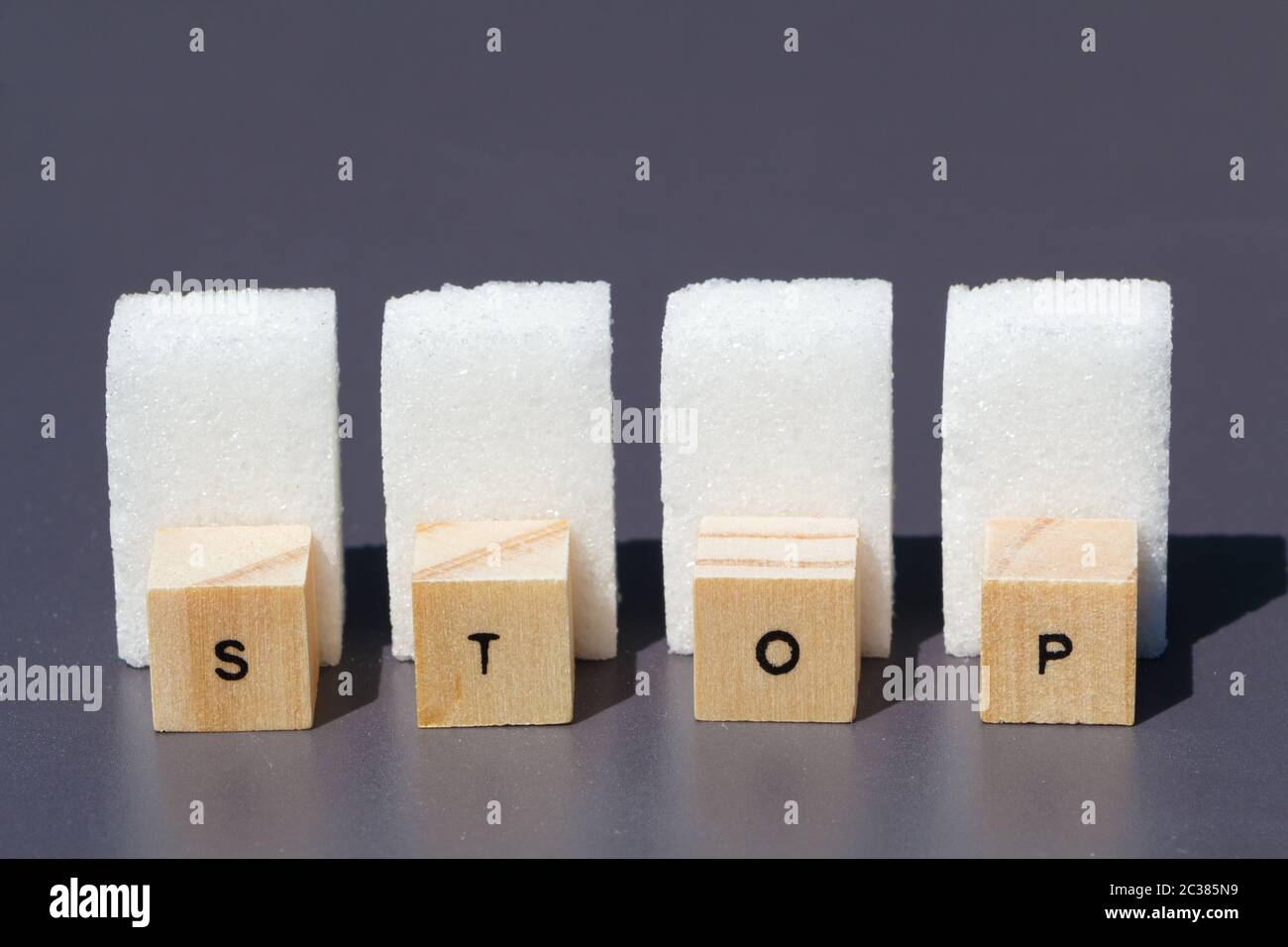 Stop written in wood letter and sugar cubes Stock Photo - Alamy