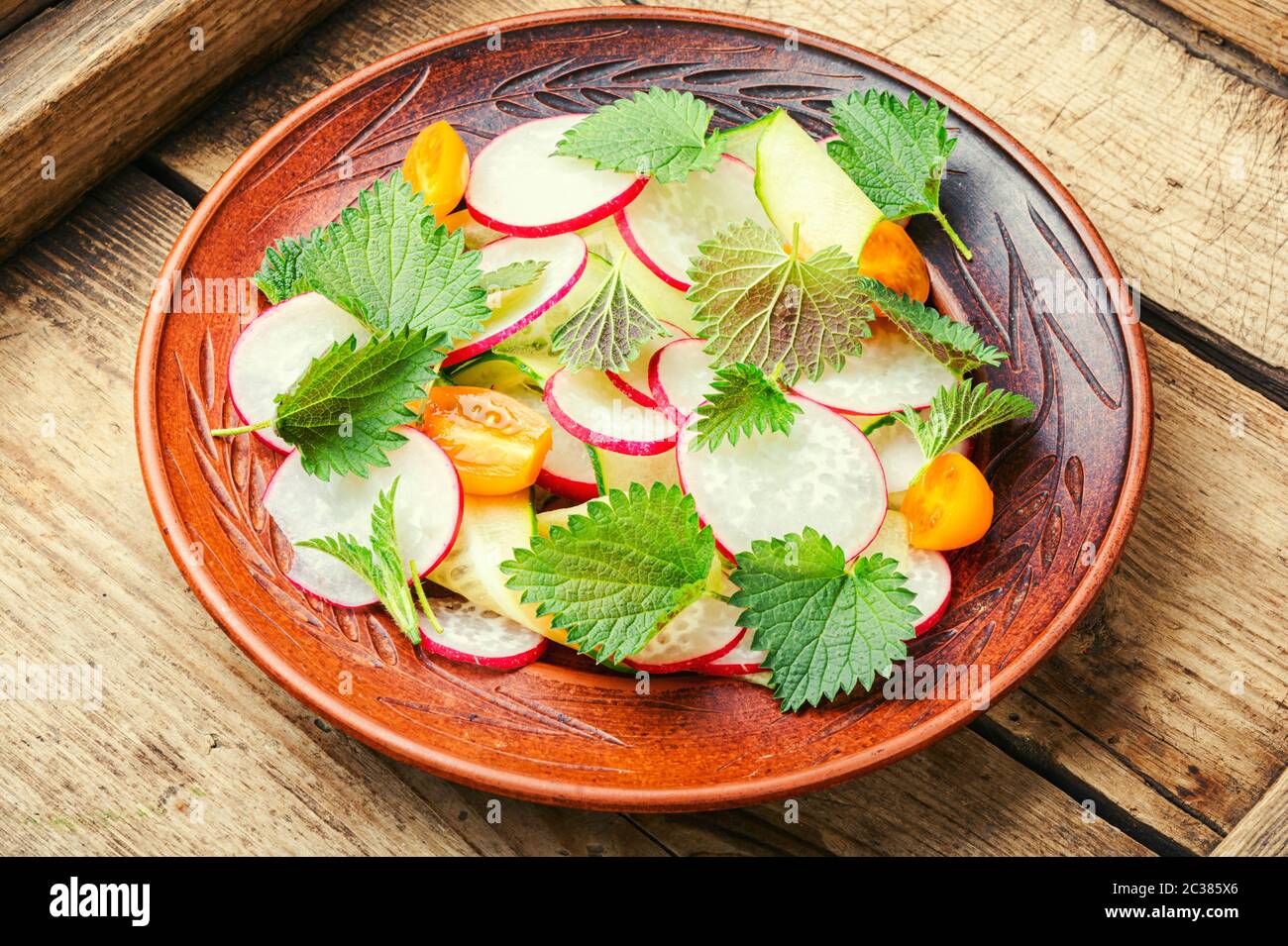 Healthy vegetable salad of nettle on plate.Healthy food concept Stock ...