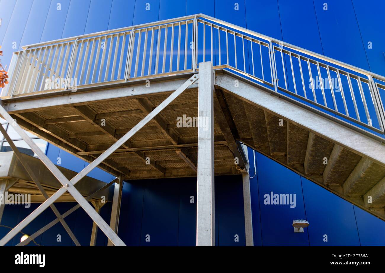 The steel walkway and steps that form teh fire esacpe of a large ...