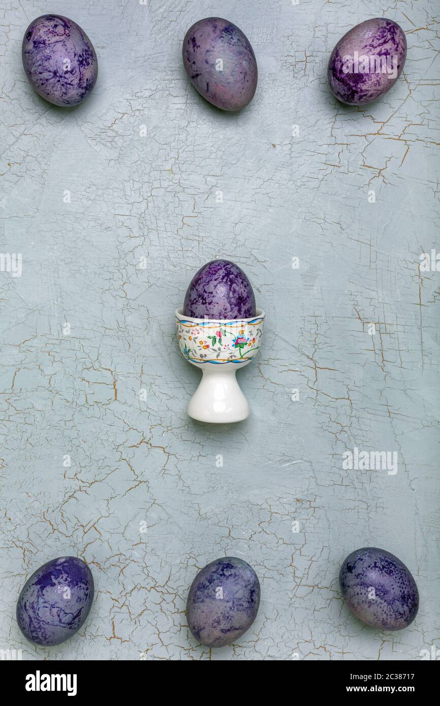 Easter colored egg in a stand Stock Photo - Alamy