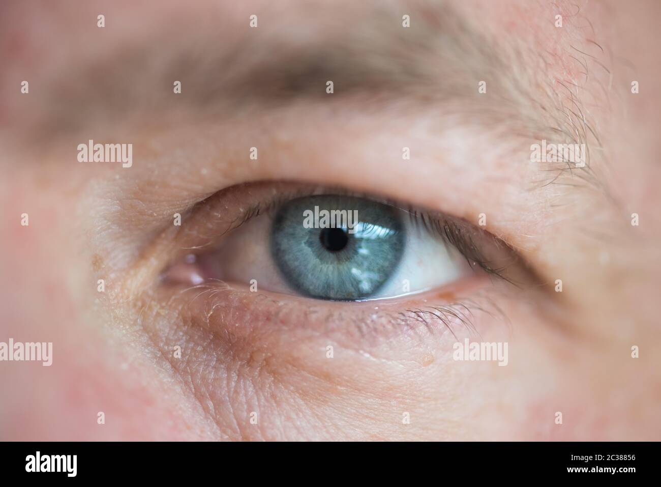 Blue eye men close up macro background Stock Photo - Alamy