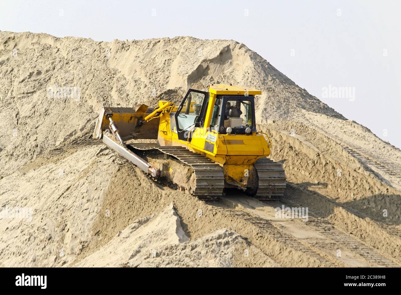 Bulldozer with track move sand at construction site Stock Photo - Alamy