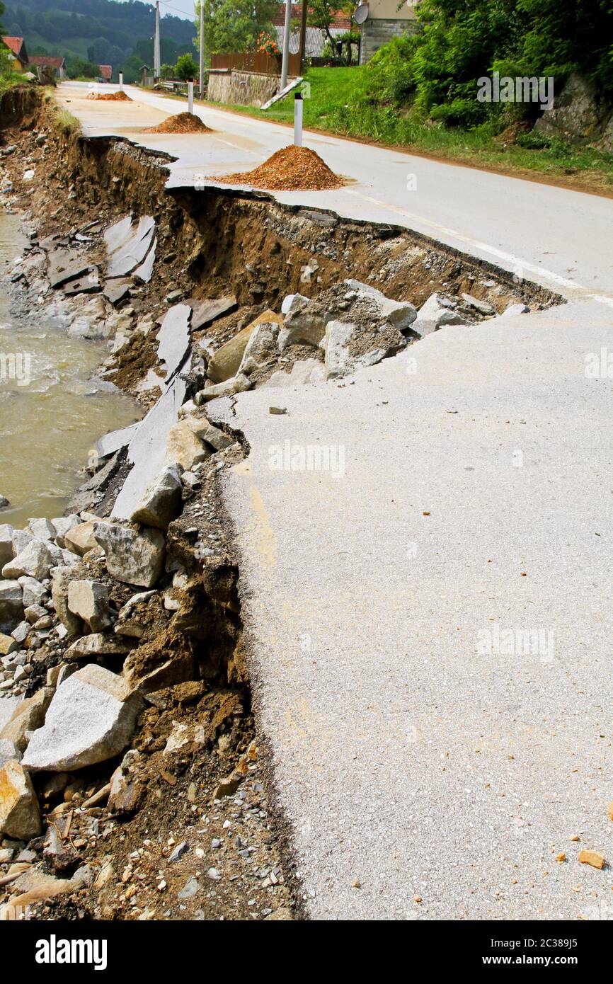 Destroyed road landslide damaged in powerful flood Stock Photo - Alamy
