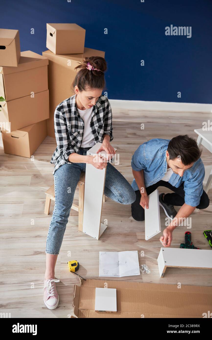 Top view of couple having problem with installing furniture Stock Photo ...