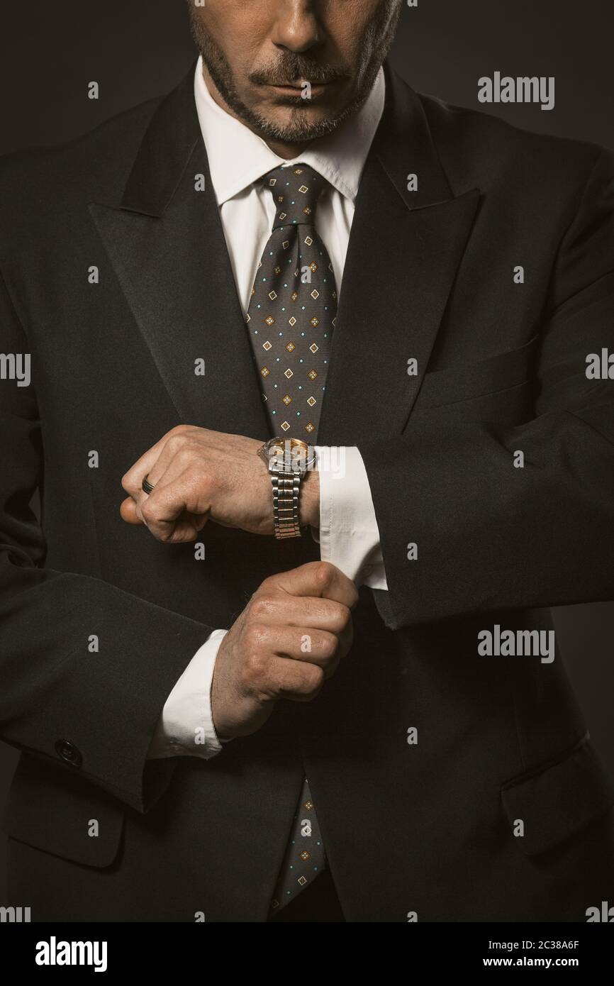 Businessman adjusting his cuffs hi-res stock photography and images - Alamy