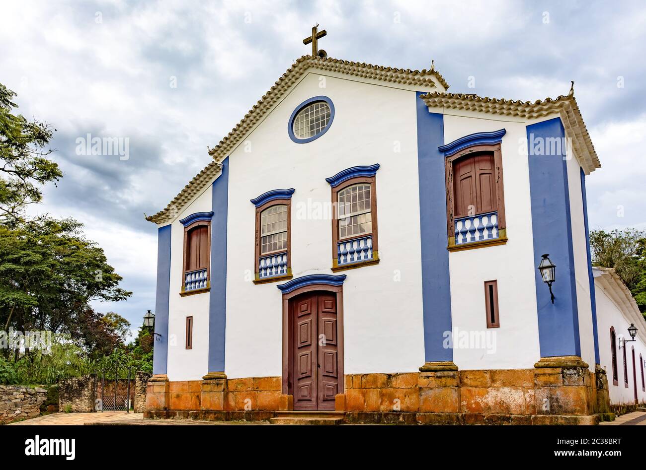 Small and old church and crucifix in colonial architecture at ...