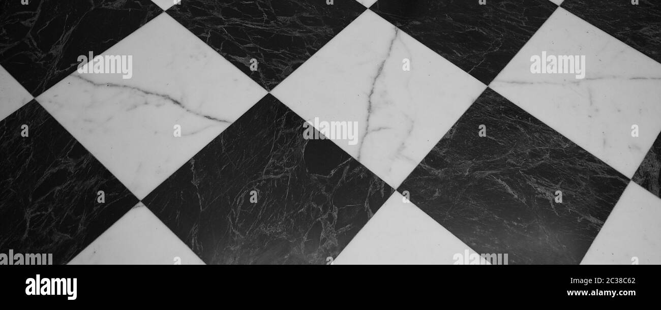 vintage black and white marble checkered floor useful as a background ...