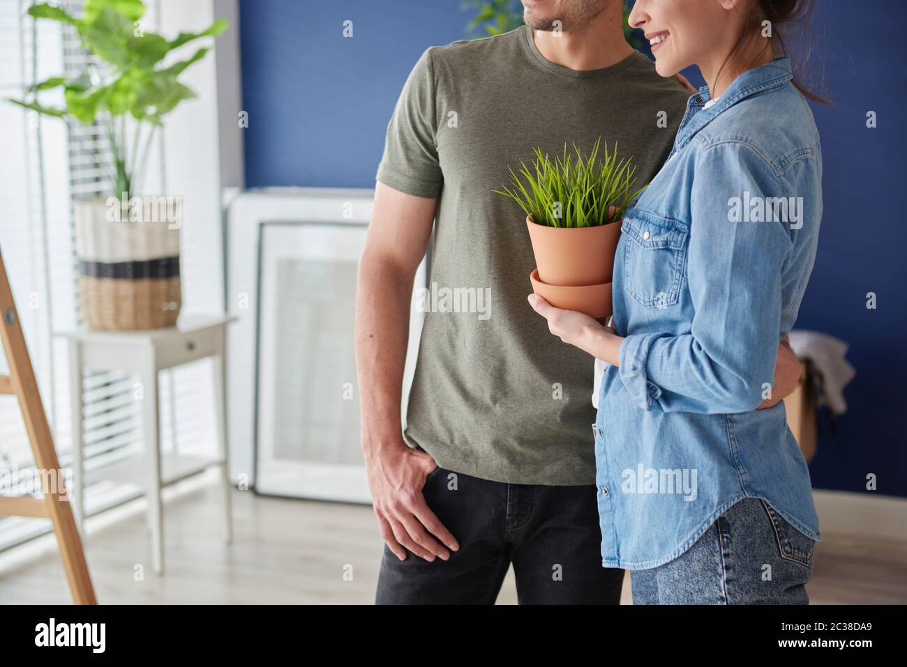 Young couple admiring their new house Stock Photo - Alamy