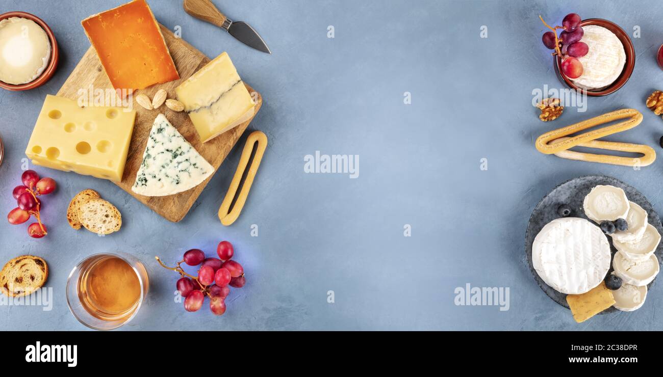 Cheese panorama. Goat cheese, Brie, blue cheese etc, shot from above ...