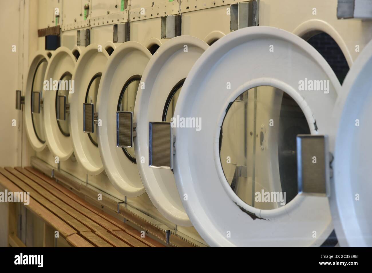 Traditional public laundry washing machine and dryer Stock Photo - Alamy