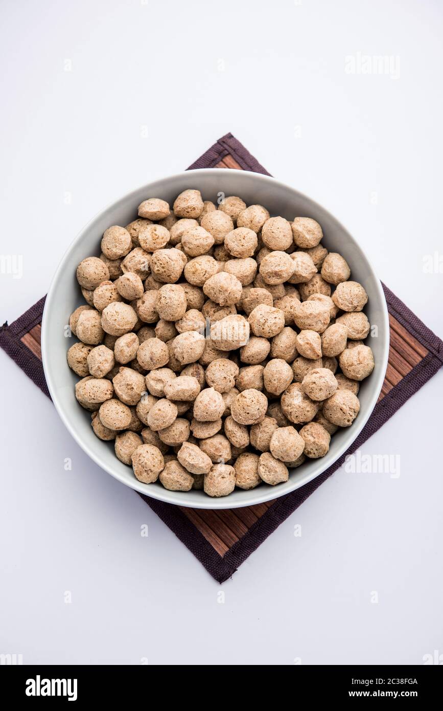 Raw Soya Chunks, Soy Meat for vegans isolated on colourful background ...