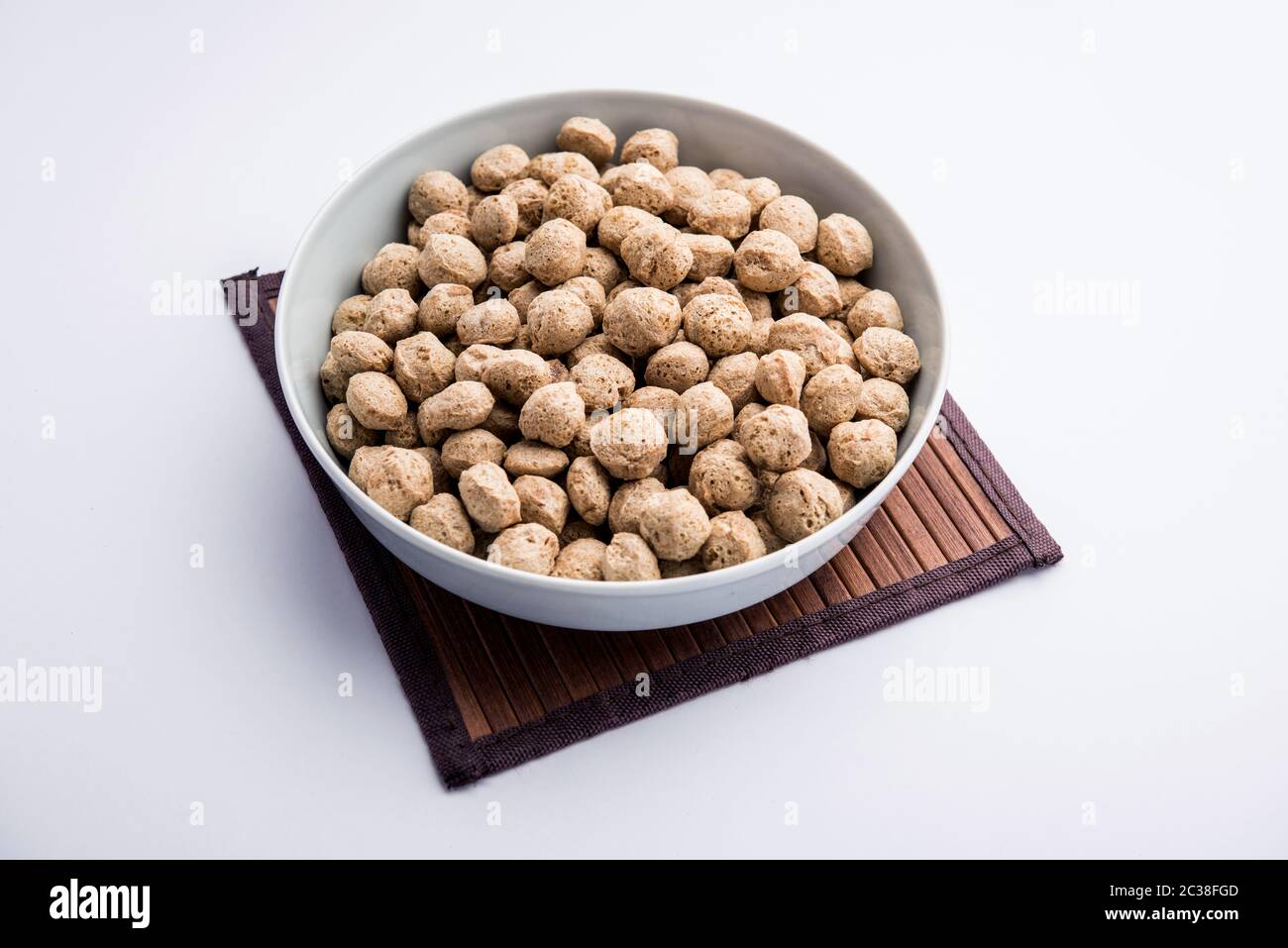 Raw Soya Chunks, Soy Meat for vegans isolated on colourful background ...