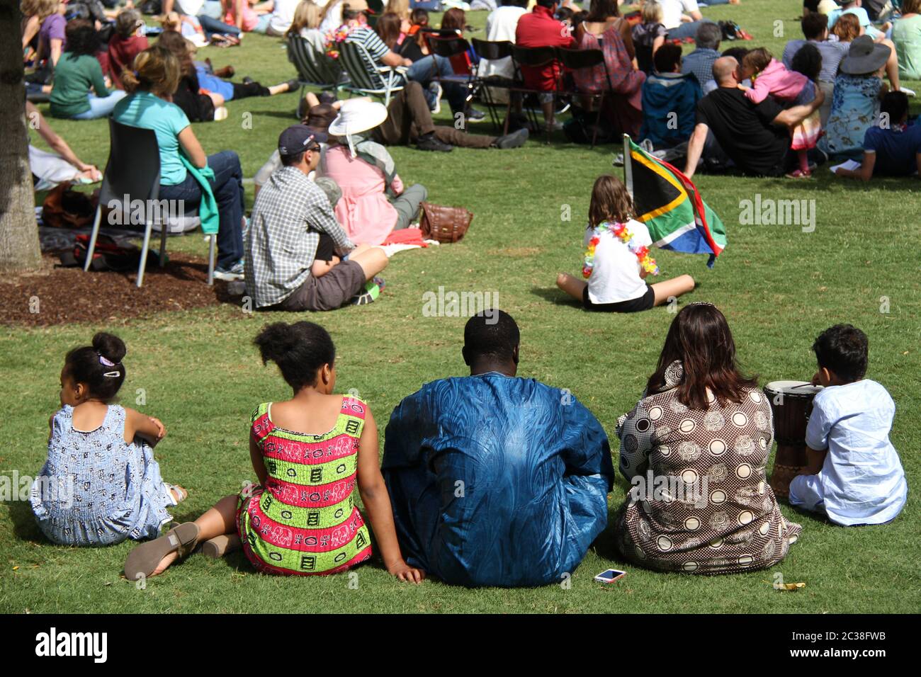 People sit on the grass at UNSW Library Lawn in Kensington, Sydney for ...