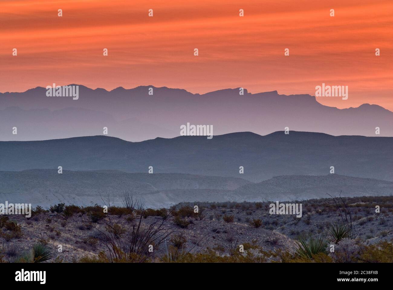 Red sky over Sierra del Carmen in Mexico at daybreak, view from road to ...