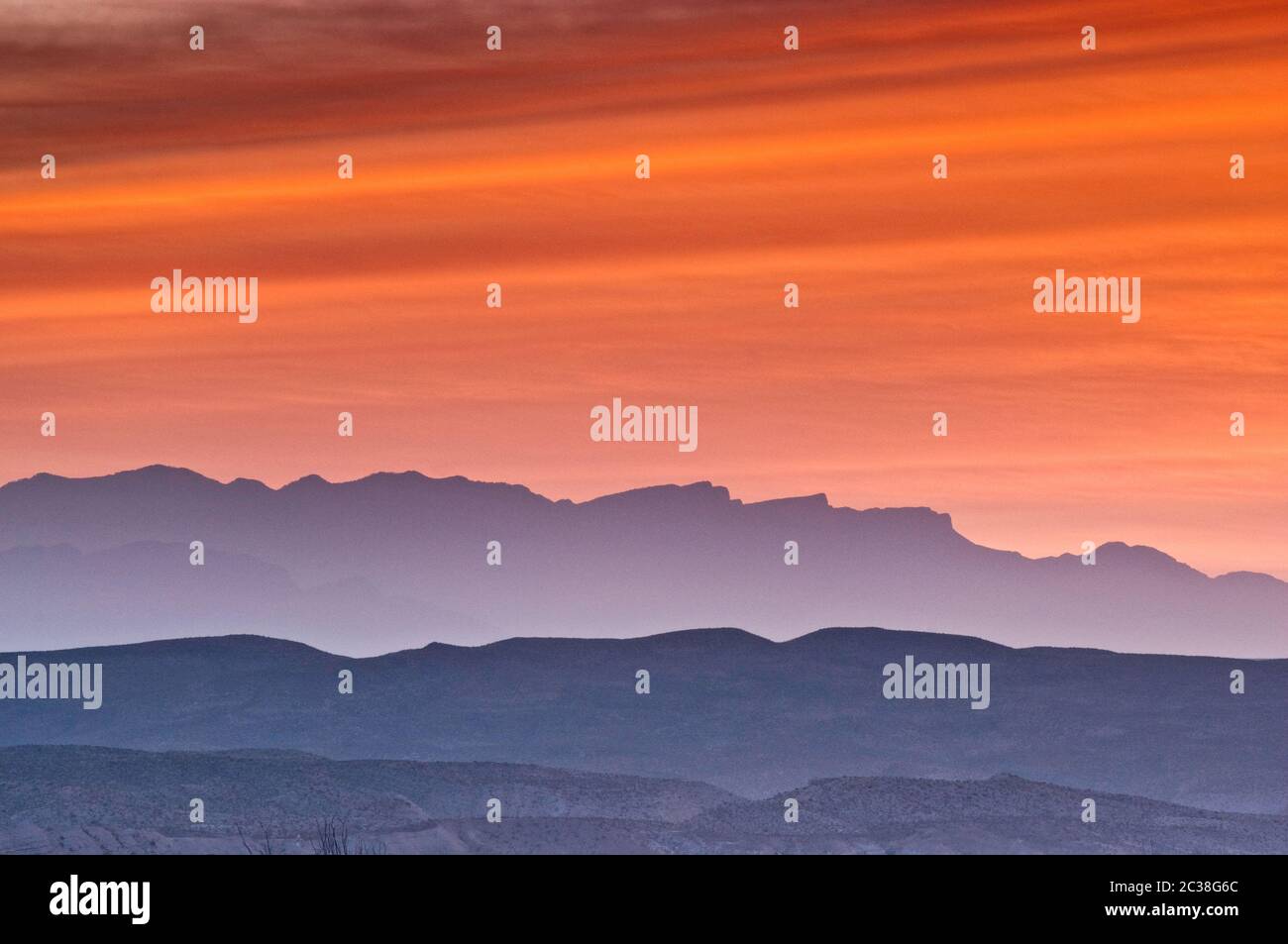 Red sky over Sierra del Carmen in Mexico at daybreak, view from road to ...