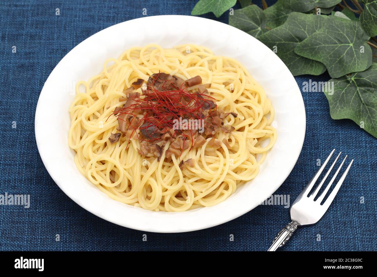 Pasta spaghetti with fresh shimeji mushroom, cream and cheese on table ...