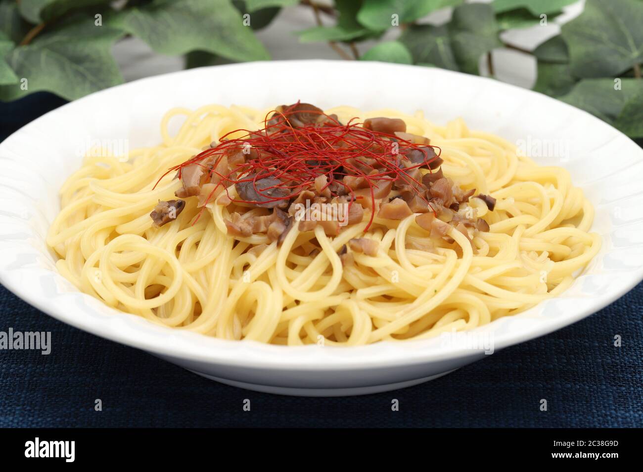 Pasta spaghetti with fresh shimeji mushroom, cream and cheese on table ...