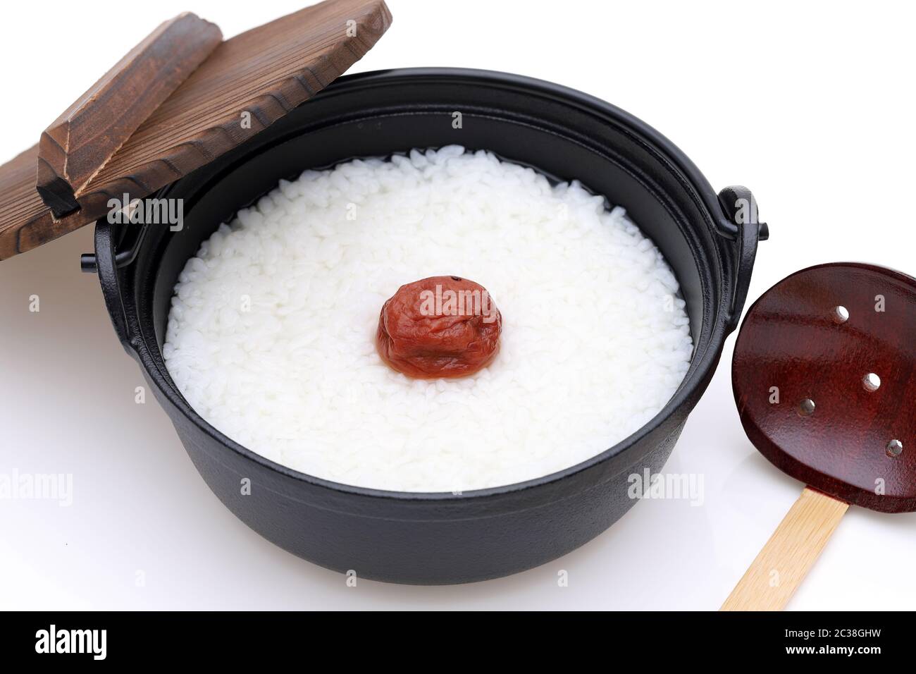 Japanese food, Okayu and Umeboshi in a nabe bowl on white background ...