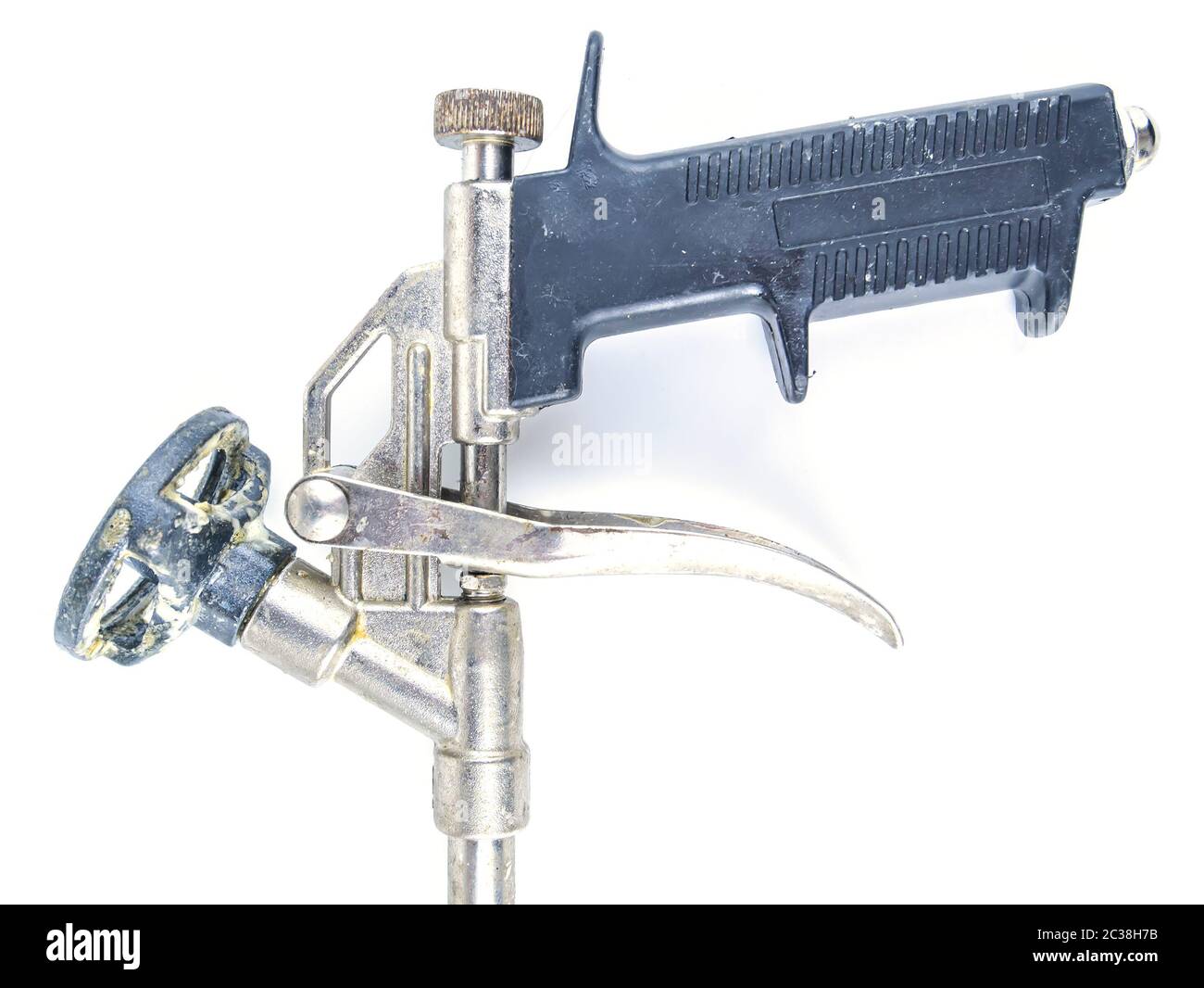 Construction tool gun for mounting foam. Place for text Stock Photo - Alamy