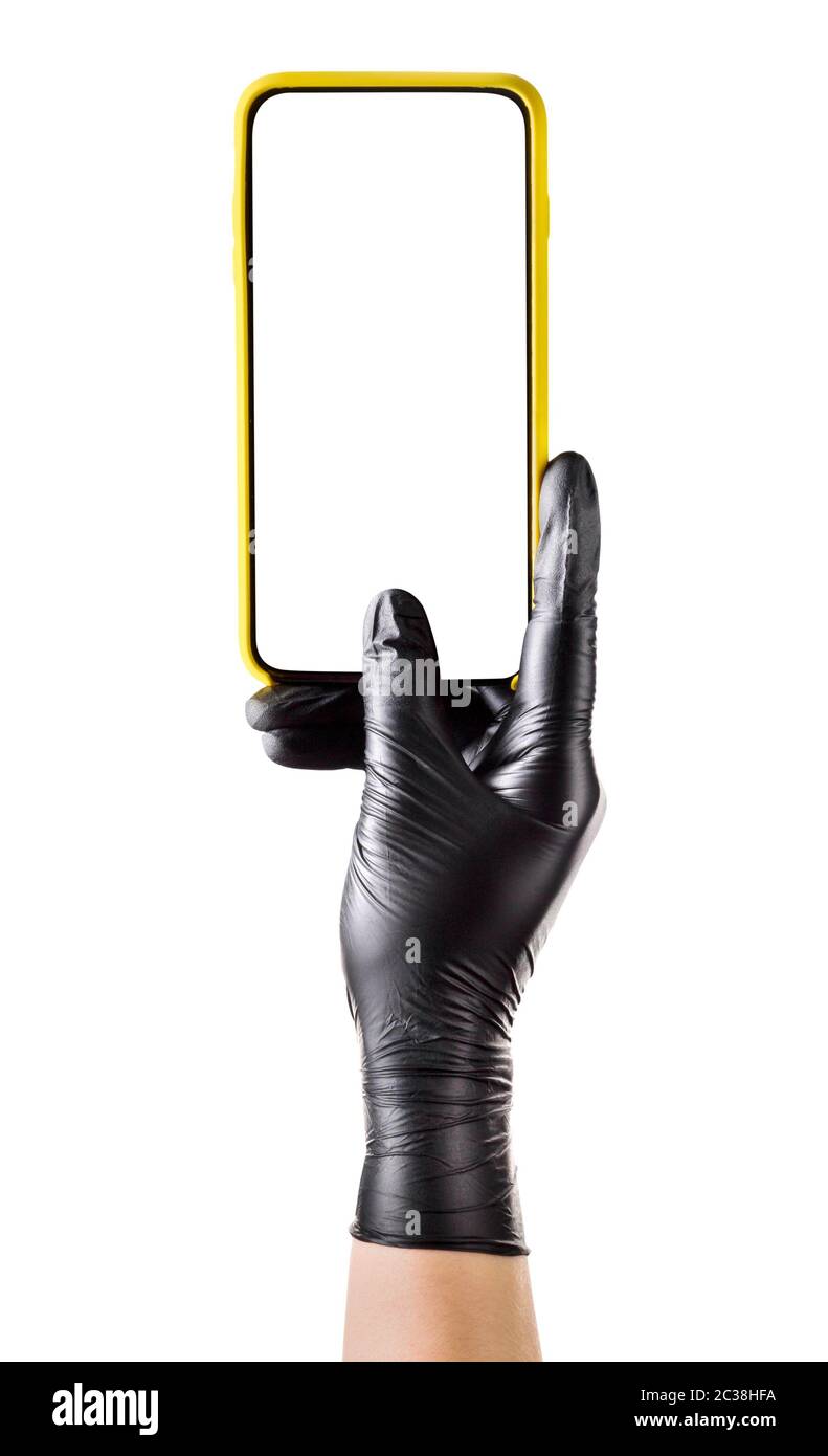 Hand in black glove holding mobile phone with blank screen isolated on ...