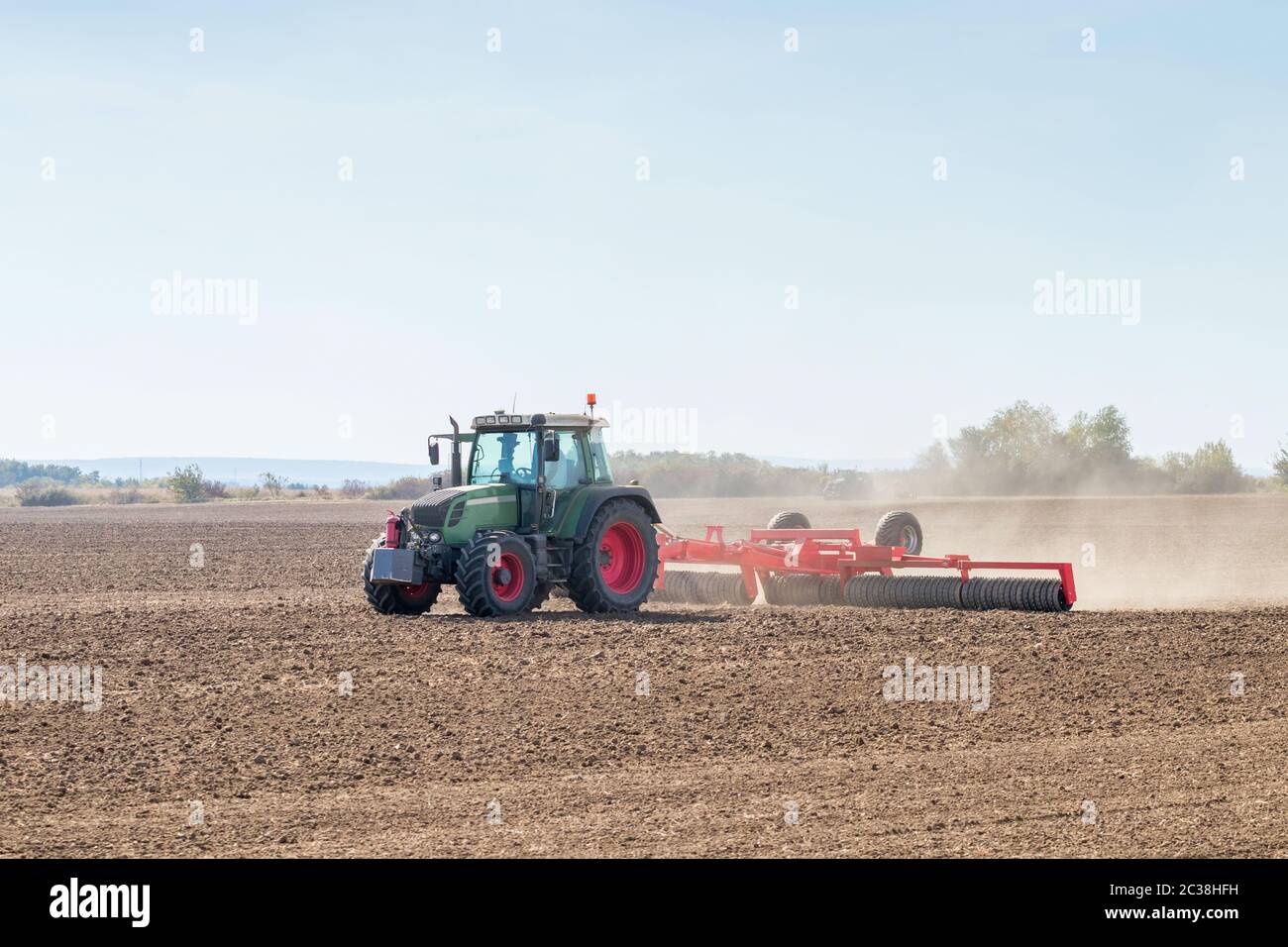 Tractor preparing field, Agriculture tractor Stock Photo - Alamy
