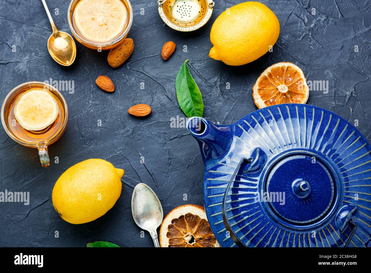 Natural ingredients for tea.Porcelain blue teapot.Useful tea with lemon ...