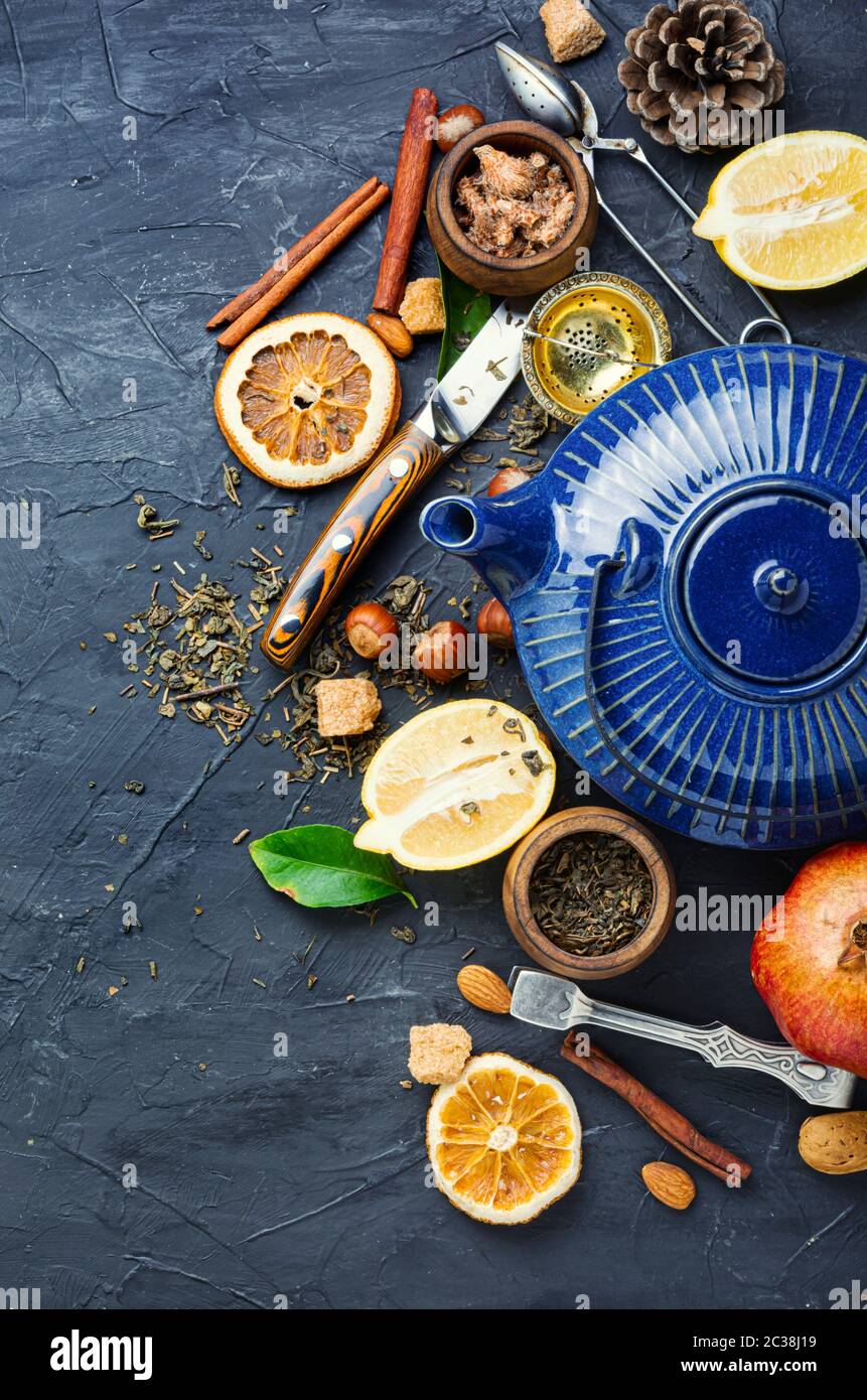 Natural ingredients for tea.Porcelain blue teapot.Useful tea with lemon ...