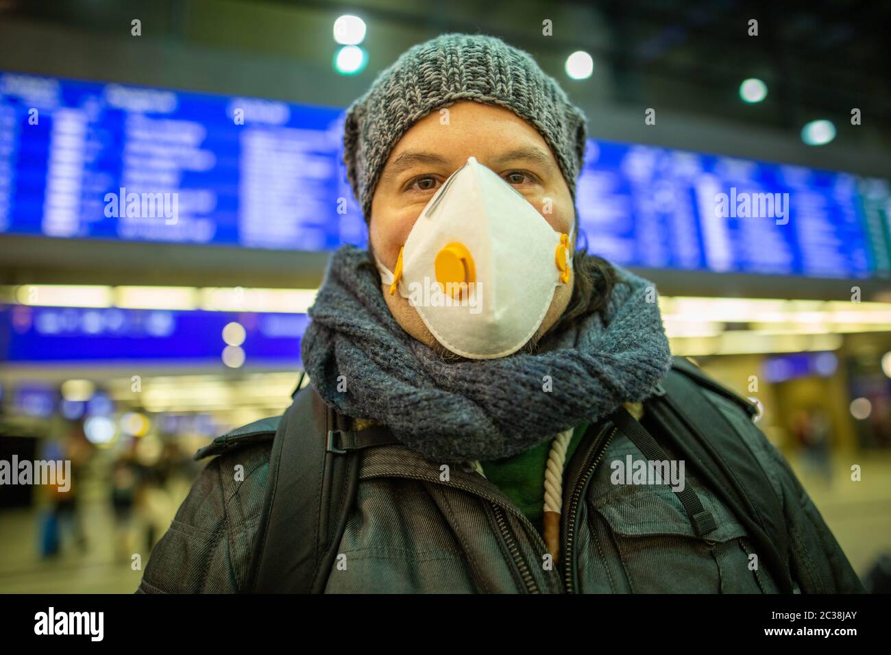 Man wearing a respirator mask device for health protection at an ...