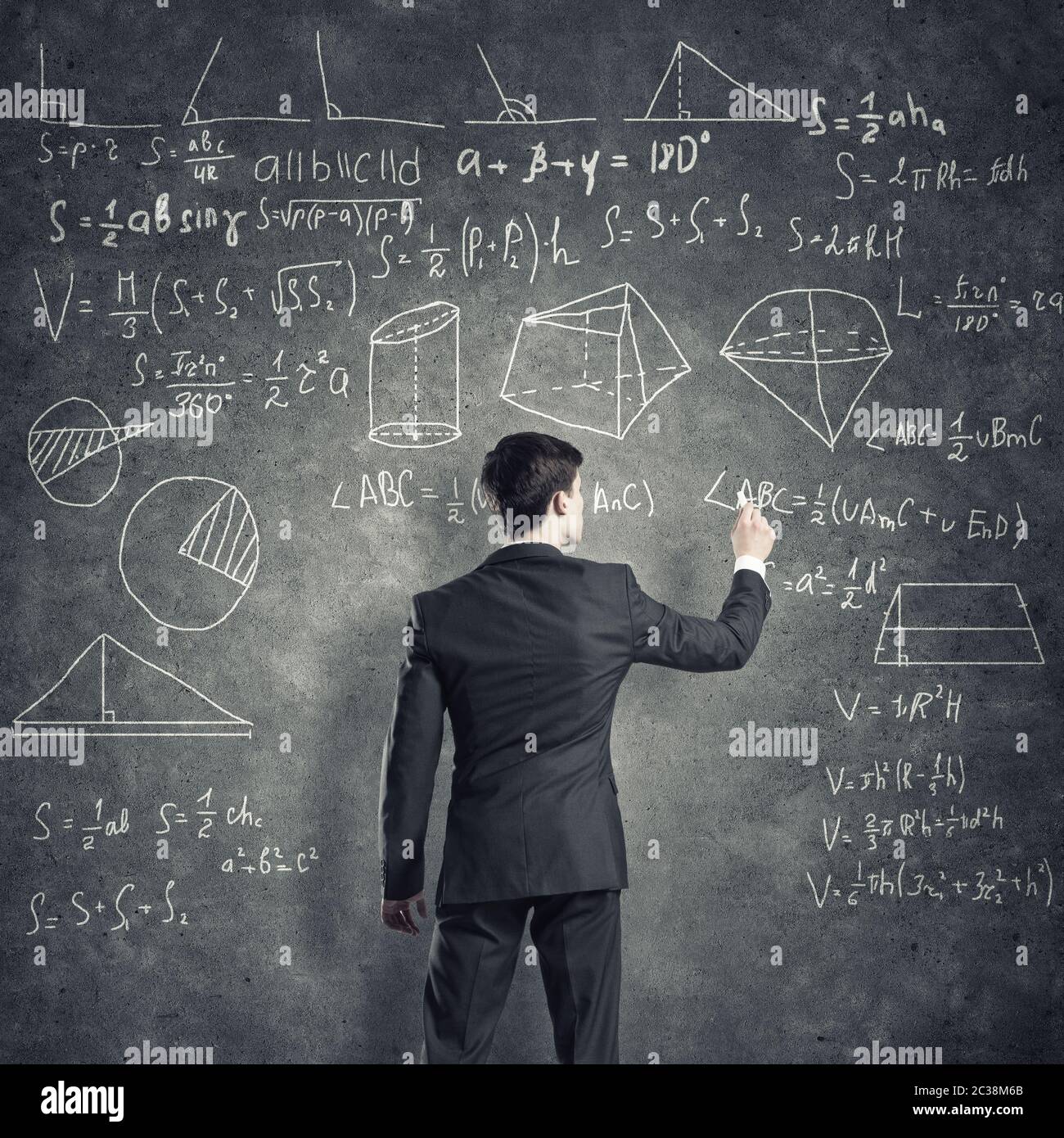 Man writing on blackboard Stock Photo - Alamy