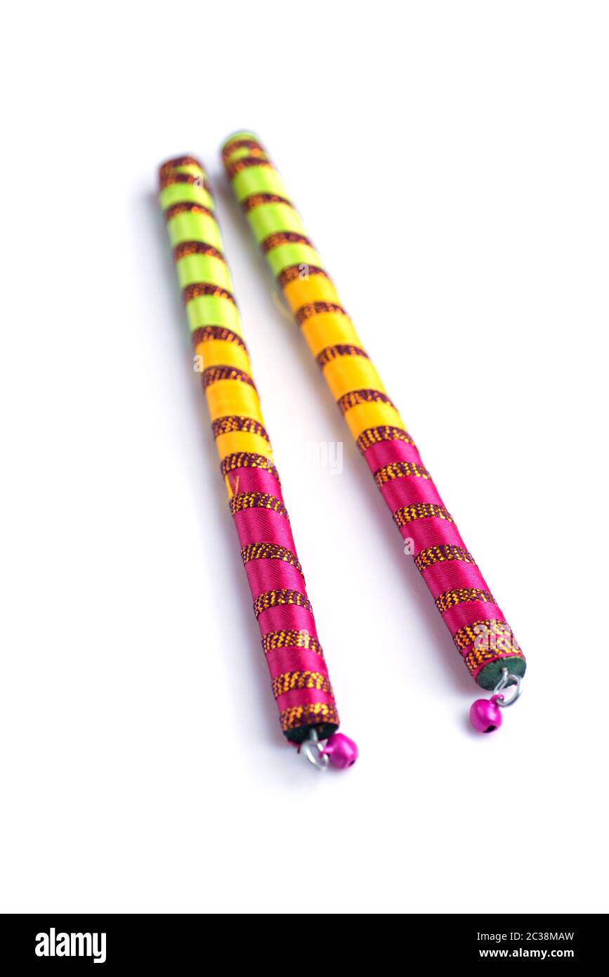 Dandiya sticks on a white background. Raas Garba or Dandiya Raas is the ...