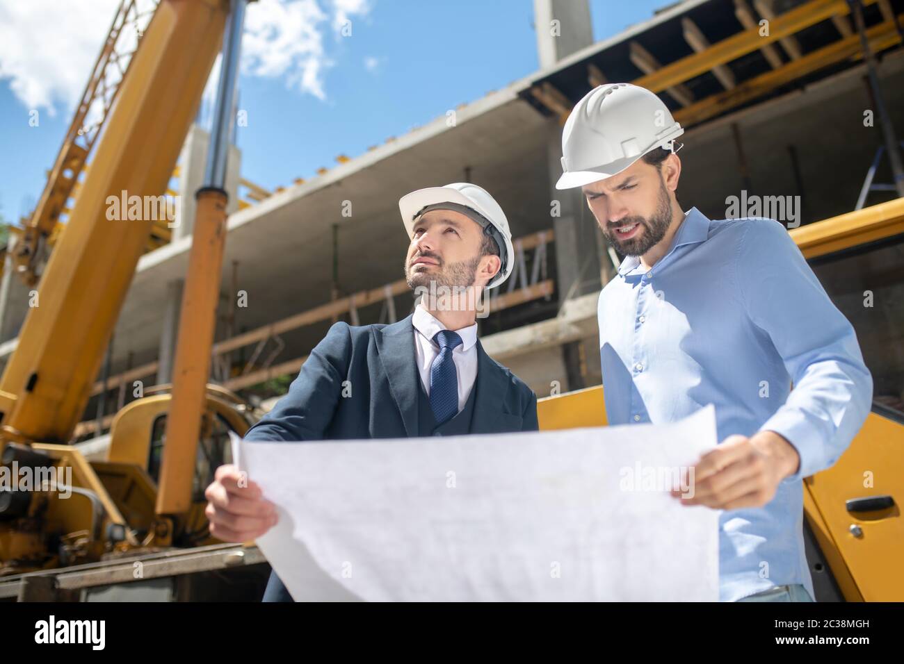 Building site. Building supervisor and foreman standing on the ...