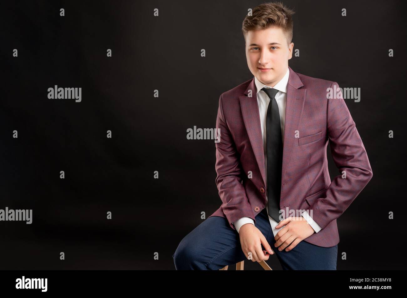 Portrait of law student with blond hair dressed in burgundy jacket ...